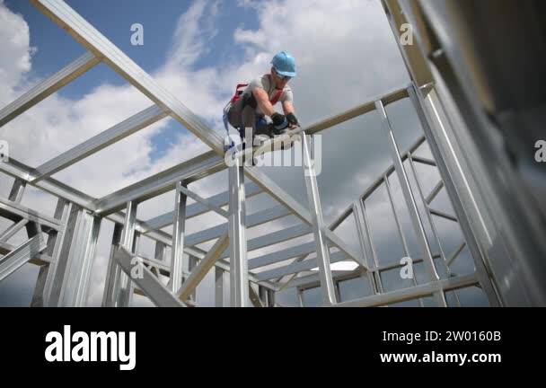 Safety Harness Equipment. Caucasian Contractor in His 30s on a Steel ...