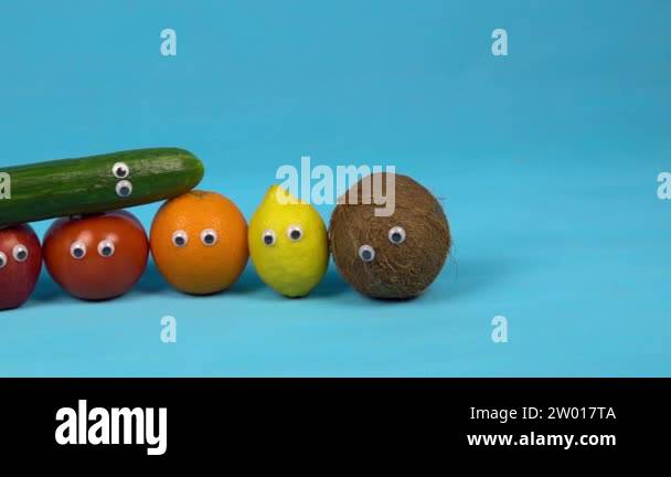 Fruit with eyes close-up. Family photo of fruits and vegetables on a ...