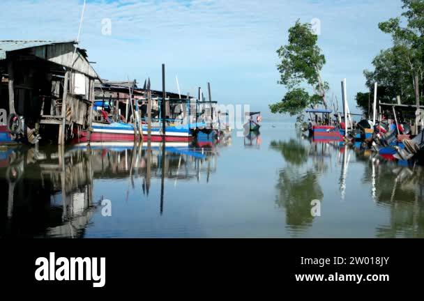 Seberang Perai, Penang/Malaysia-Jun 20 2018: A fisherman go back the ...