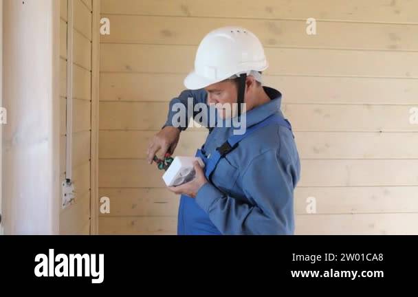 professional electrical engineer performs installation of electrical ...