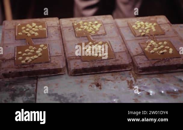 chocolate factory, the process of making chocolate. pouring liquid ...