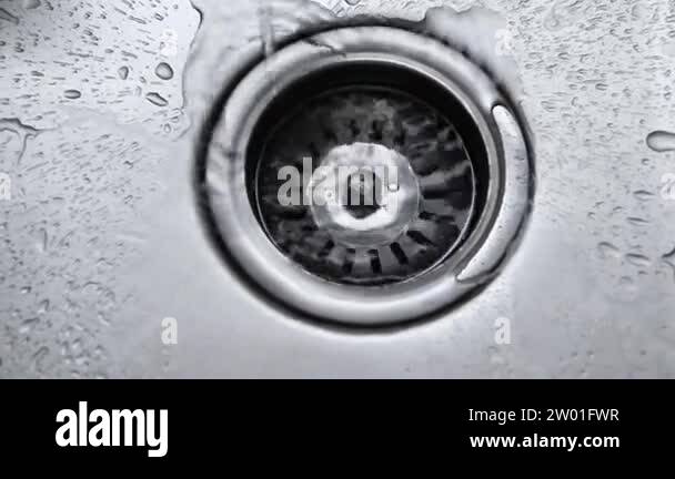 Water dripping in stainless steel kitchen sink Stock Video Footage - Alamy