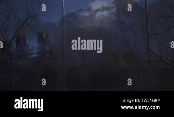 Digital composite of a factory with smoke coming out of an industrial ...