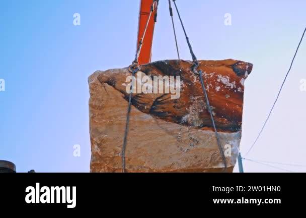 Marble blocks and crane on quarry. Crane machine and equipment for ...