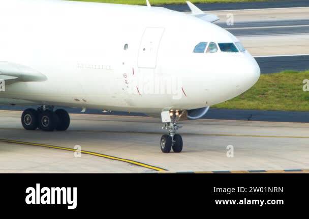 White Airbus A310 Cargo Freight Airplane Turning on an Airport Taxiway ...