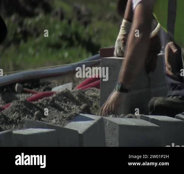 Bricklayer placed cobblestone sidewalk construction Stock Videos ...