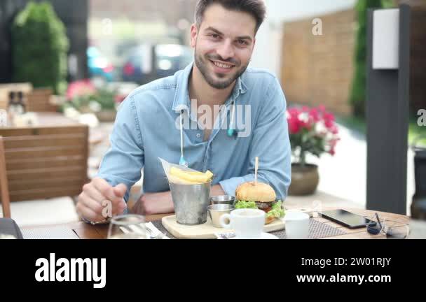 Man eat hamburger in Stock Videos & Footage - HD and 4K Video Clips - Alamy