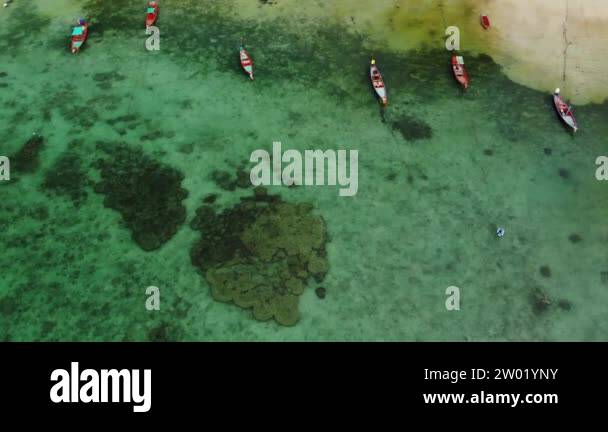 Fishing boats near reef. Beautiful aerial view of fishing boats ...