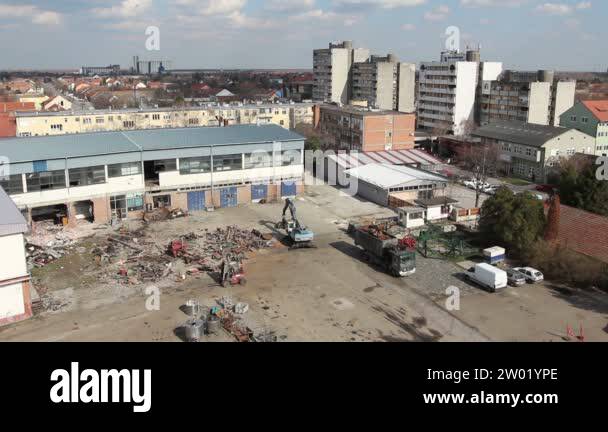 Loader manipulator with hydraulic grappling claw is loading scrap metal ...