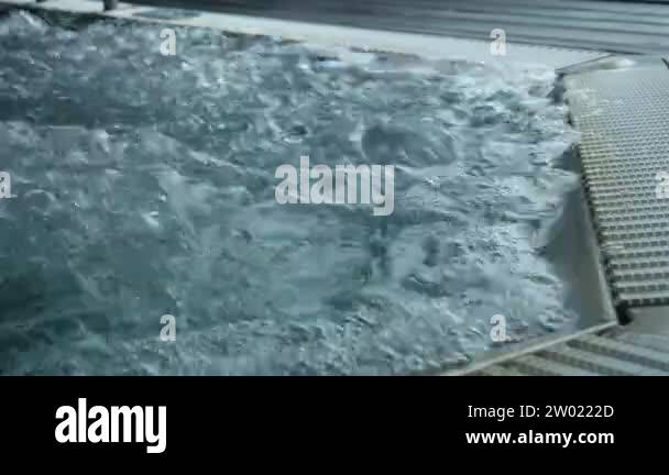 Big bubbles in warm water in a jacuzzi pool showing the texture of ...