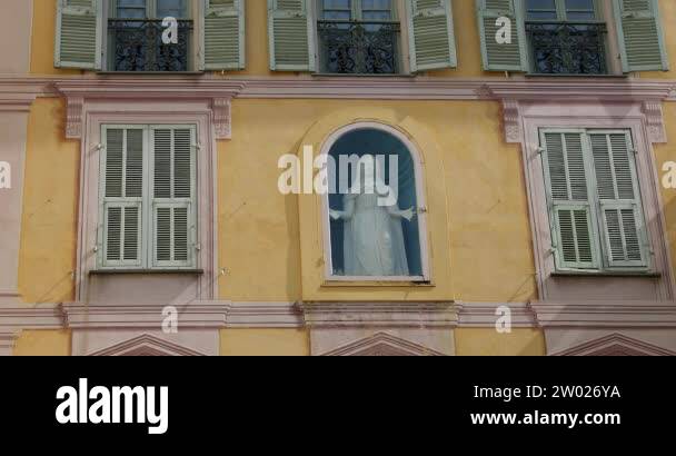 Virgin Mary Sculpture On The Typical Colorful Facade Of A House In The ...