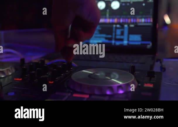 DJ console for mixing dance music and laptop in disco club. DJ mixer ...