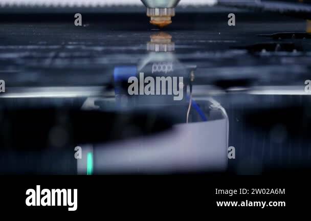 Cutting of metal. Sparks fly from laser. Industrial laser cutter with ...