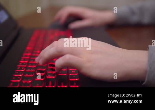 gamer playing online video game laptop keyboard, hacker typing hands close up Stock Video ...