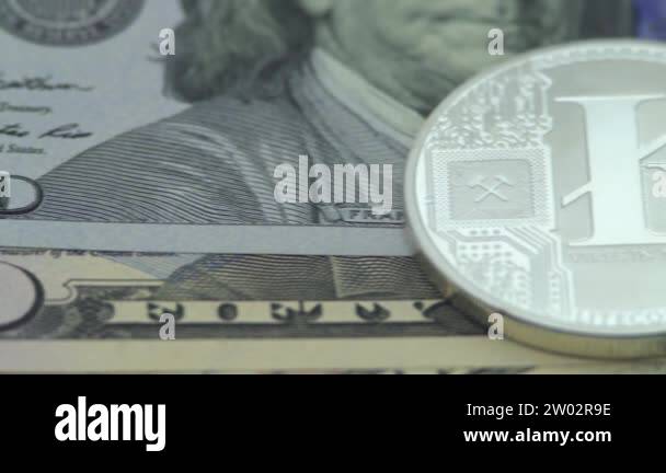 4K Physical metal silver Litecoin currency over 100 dollar bill of ...