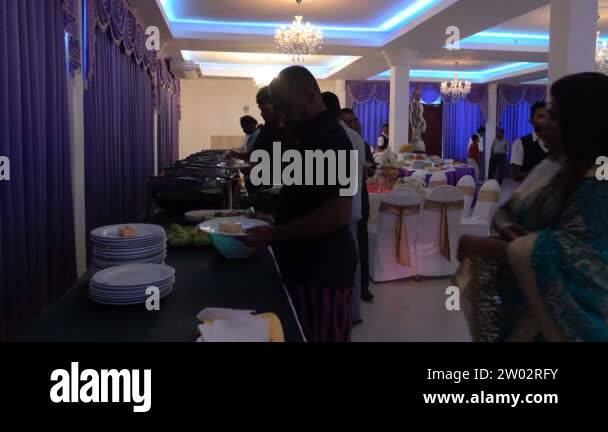 Wadduwa, Sri Lanka - May 11, 2018: People take plates of food. Swedish ...