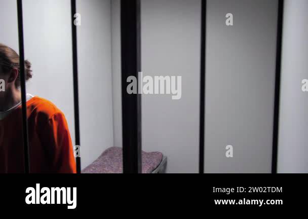 Prisoner walks in a circle in a prison cell Stock Video Footage - Alamy