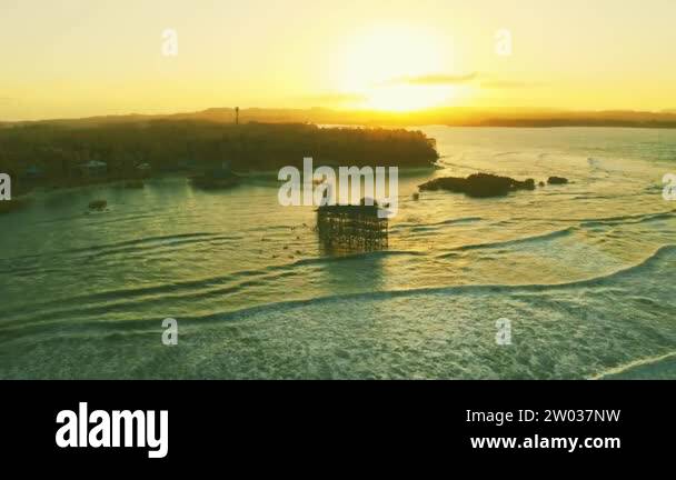 Big waves are coming and Beautiful sunset landscape at the wooden ...
