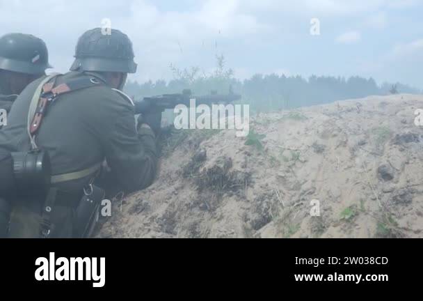 German soldiers firing a machine gun. Reconstruction of military ...