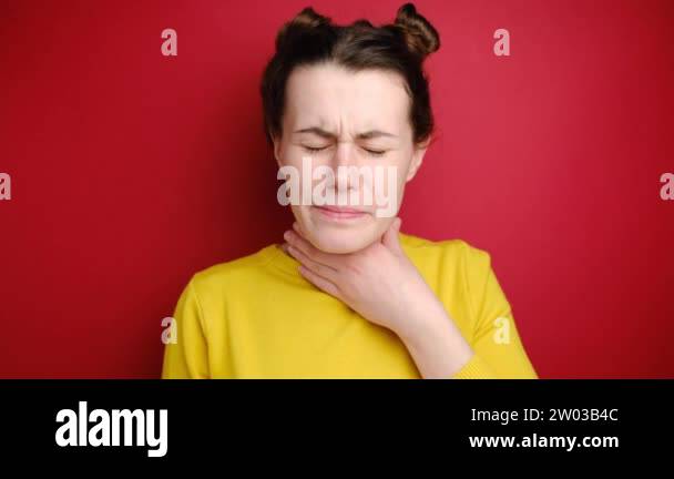 Respiration problems. Unhappy sick woman touches neck, suffers from ...