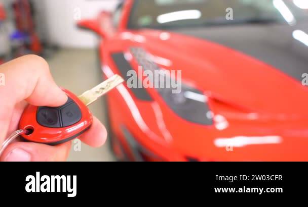 Men's hand presses on the remote control car alarm systems, Car Auto ...