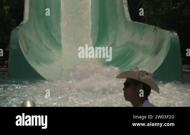 Two Children Sitting Inside a Large Inflated Tube Drops Down from a ...