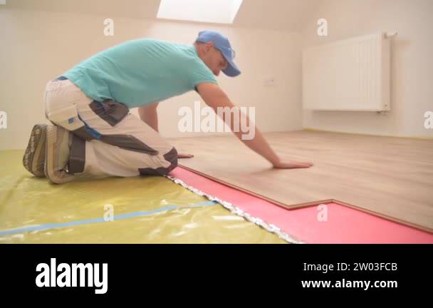 New Hardwood Floor Panels Installing by Professional Installer. Home ...