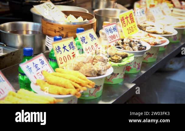 4k Asian food stand sell fried seafood, squid, dumpling, clams, prawn ...