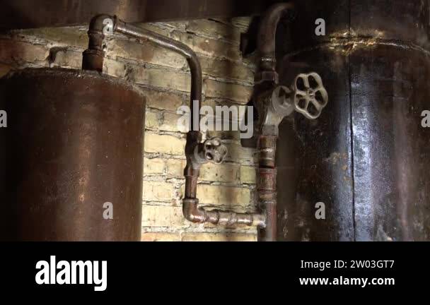 Rusty boiler room pipes. Old metal boiler generating heating and ...