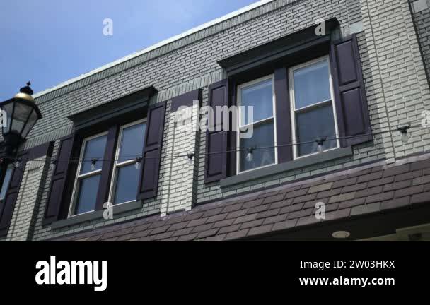 Establishing shot of second story cute store front Stock Video Footage ...