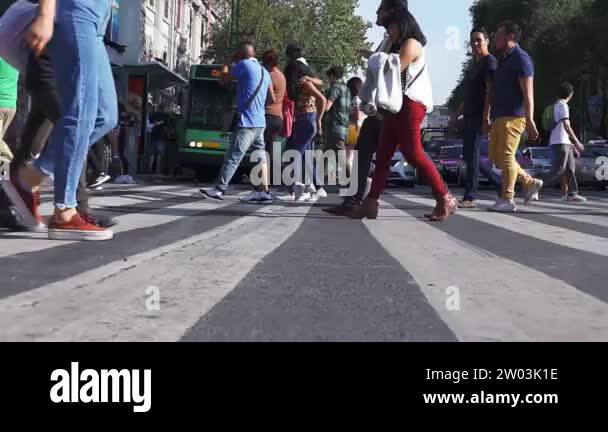 MEXICO CITY, JUNE 2019 (SLOW MOTION). People walking and crossing the ...