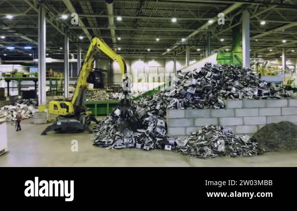 Industrial machine is transporting waste in a landfill unit. Recycling ...