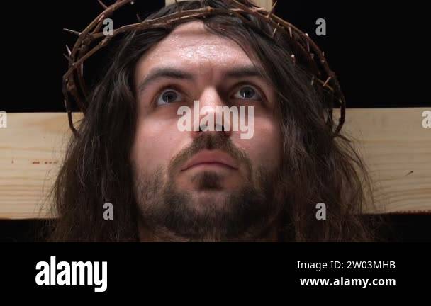 Jesus Christ crucified on cross and looking to heaven, praying father, close-up Stock Video ...