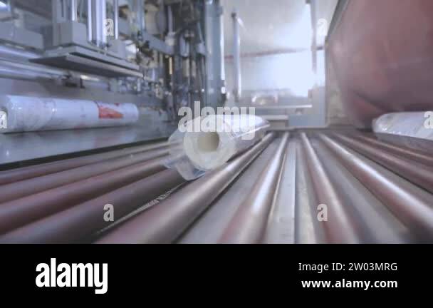 Automated wallpaper production line. Wallpaper production process in a ...