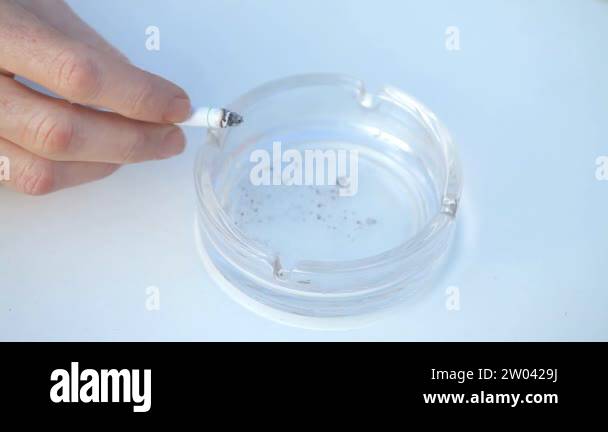 Cigarette stub hand Stock Videos & Footage - HD and 4K Video Clips - Alamy