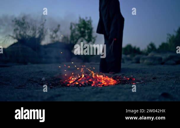 Witch at night forest. Witch conjuring in the forest conducts rituals ...