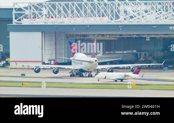 Boeing 747-400 Towed into Delta Airlines Maintenance Facility with ...
