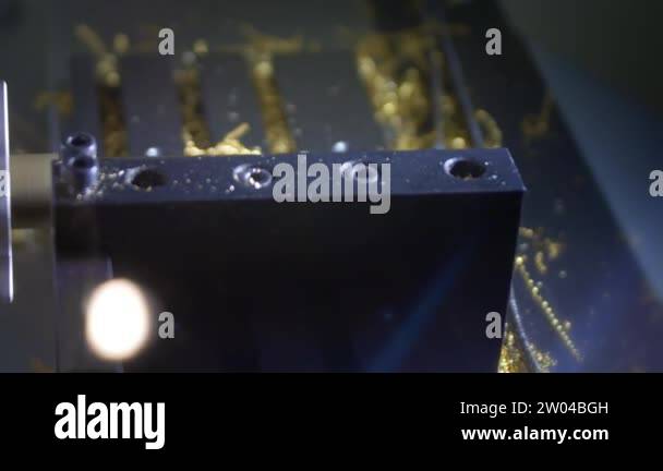 Metalworking milling machine. Produces fine gold detail in a factory ...