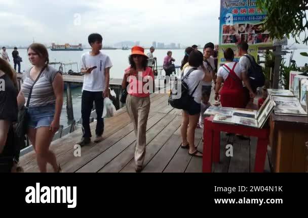 George Town, Penang/Malaysia-Jun 02 2018: Visitor enjoy the view at the Chew Jetty with ...