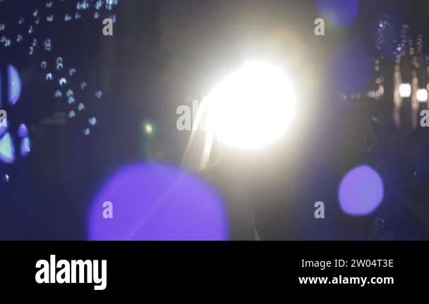 Two lovers couple hugging and kissing in the colorful UV light of a ...