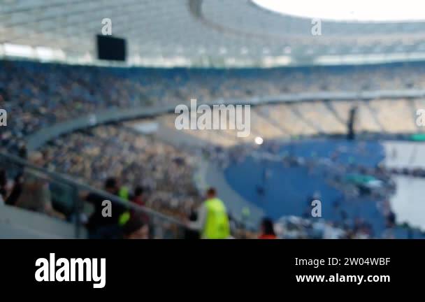 4k out of focus panning video of crowd of fans in fan zone and people ...