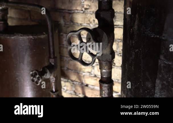 Rusty boiler room pipes. Old metal boiler generating heating and ...