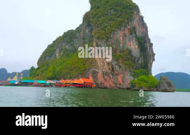 Impressive limestone rock of Ko Panyi (Koh Panyee) island with colorful ...