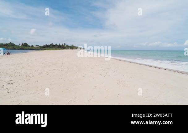 Beach beside lagoon. Lagoon called Maceio in front of the sea separated ...