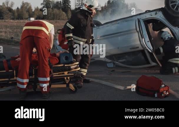 Car Crash Traffic Accident: Paramedics and Firefighters Rescue Injured ...