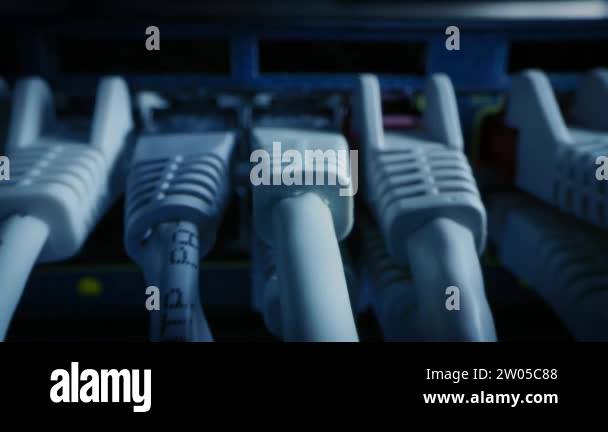 Close-up Macro Shot: Ethernet Cables Connected to Router Ports. Telecommunications: RJ45 Device ...