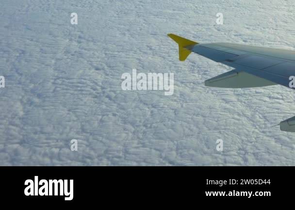 4K Traveling by air. Plane wing in flight trip. Beautiful sky ...