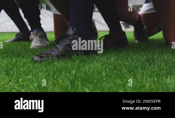 Close-up of diverse male rugby players playing rugby match in stadium ...