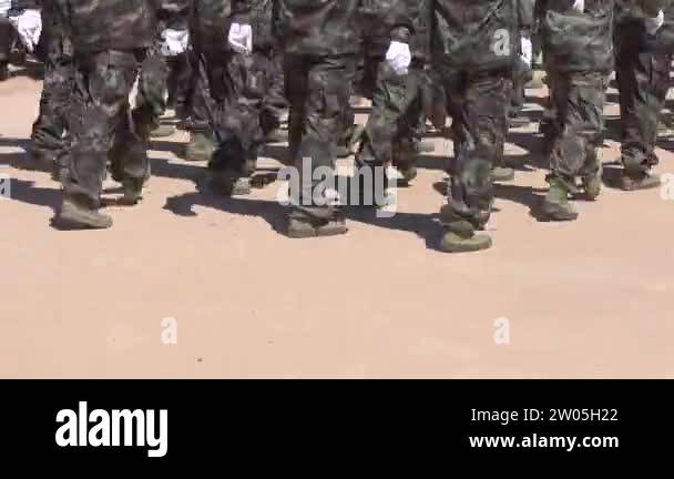 Soldiers with camouflage uniform marching in formation on parade at ...
