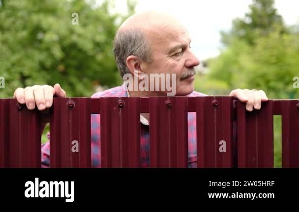 Man watching over fence Stock Videos & Footage - HD and 4K Video Clips ...